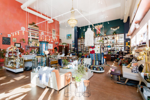 Bright New Storefront with high lofted ceilings and stylish props and ...