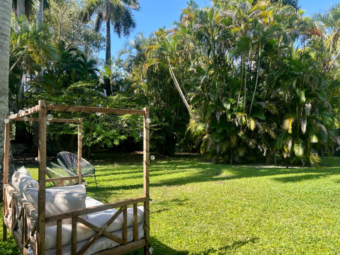 Tulum Jungle Oasis in Miami – Lush Tropical Backyard with Deck & Couch ...
