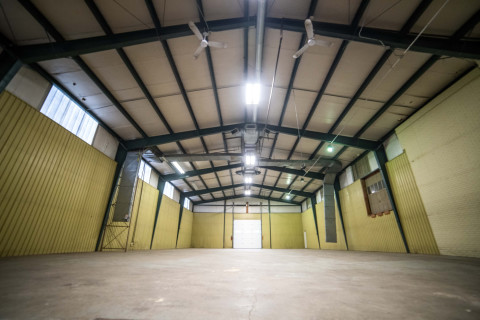 Industrial-style Empty Warehouse with Extremely High Vaulted Ceilings ...