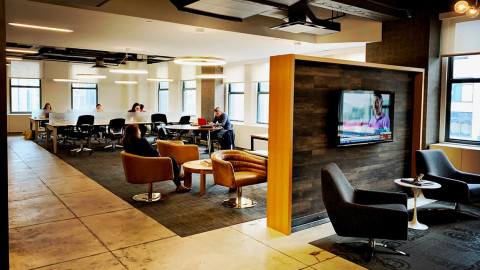 Open Cool Lounge Area in an office setting with open ceilings, natural ...