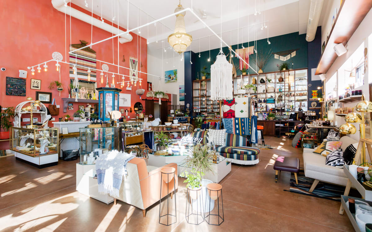 Bright New Storefront with high lofted ceilings and stylish props and ...