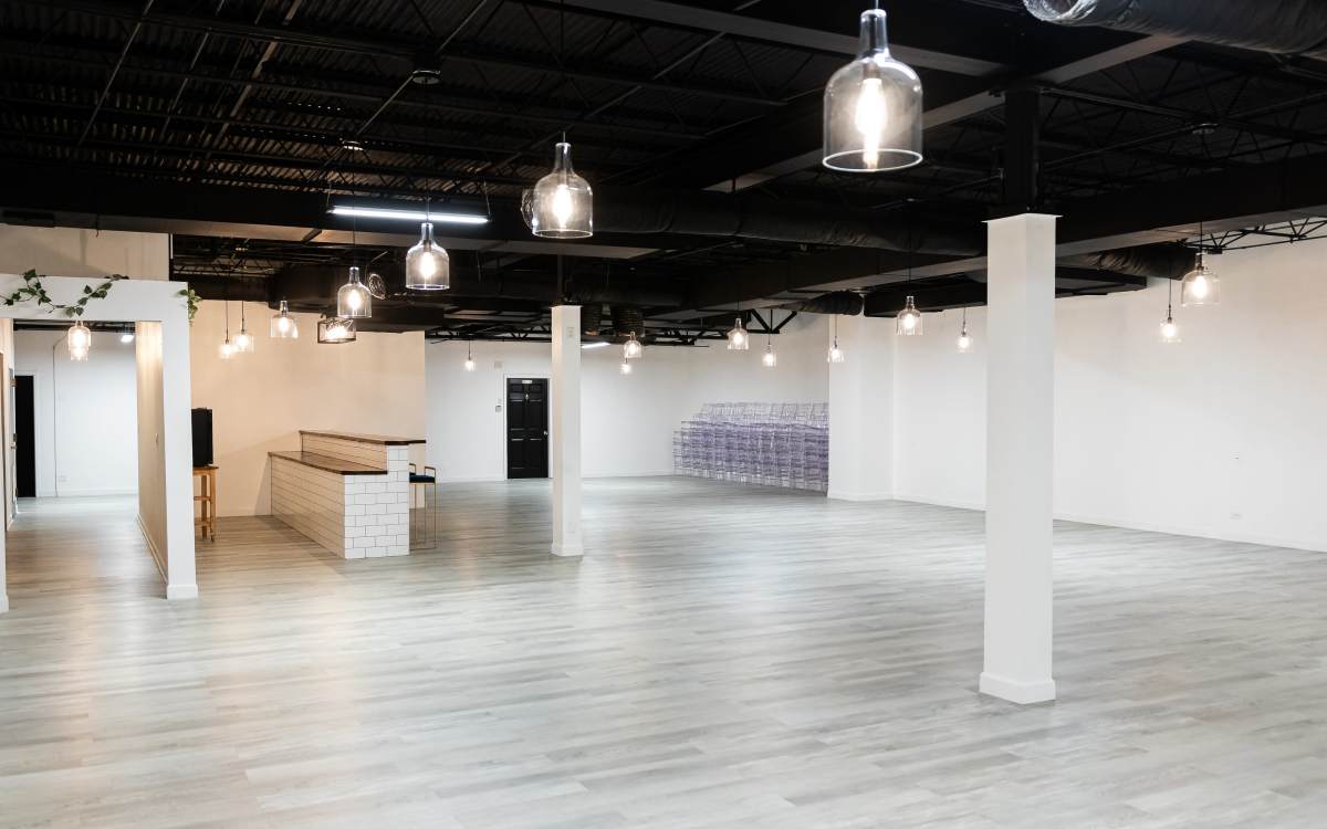 Chic Elegance: A Stylish Venue with Black Ceilings, Grey Floors, and ...