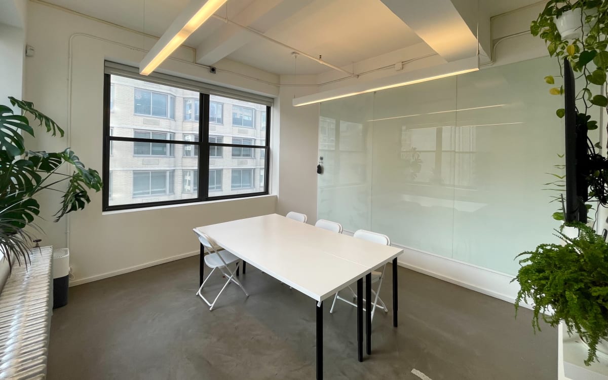 Light filled large meeting room with floor-to-ceiling white boards, New ...