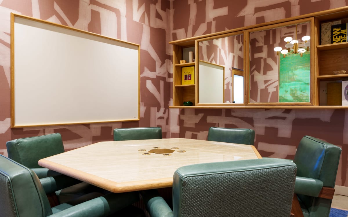 Bright window-lined meeting room with floor-to-ceiling views of ...