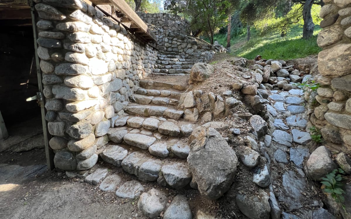 Enchanted Outdoor Space with stone walls, pathways, and stairways at ...