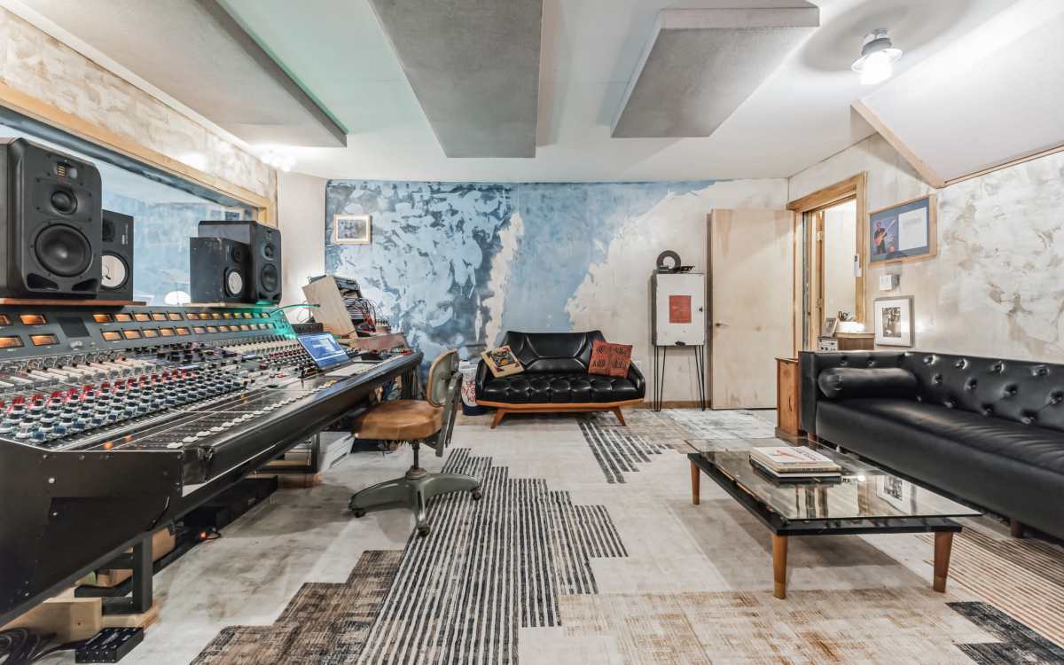 Spacious elegant recording studio with natural light and a refined ...
