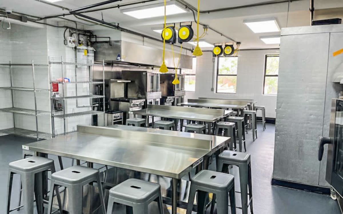 Commercial Kitchen With Loads of Light and Stainless Steel Appliances ...