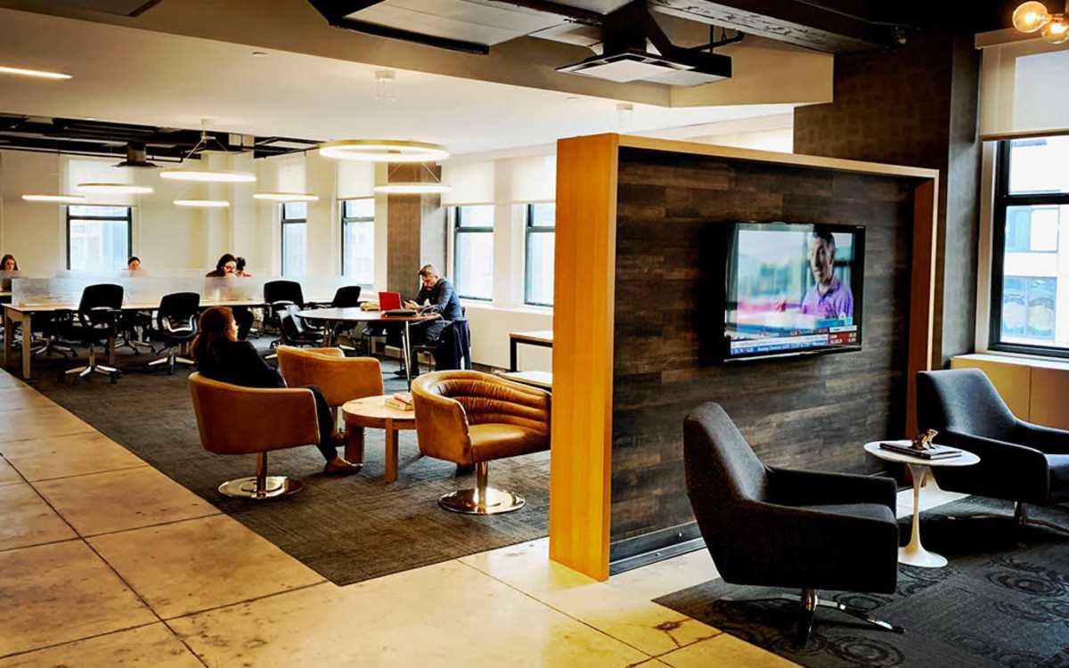 Open Cool Lounge Area in an office setting with open ceilings, natural ...