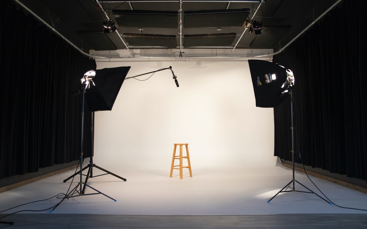 Spacious studio space equipped with lighting, props, and multiple ...