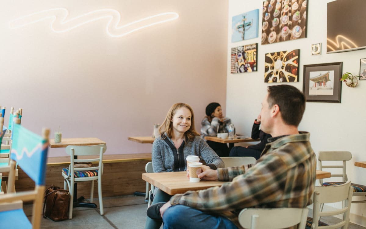 Trendy 90s cafe and coffee shop in an urban downtown setting ...