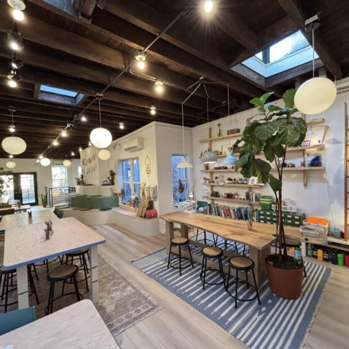 sky lit multi-use space with hand-crafted decor and plants galore ...