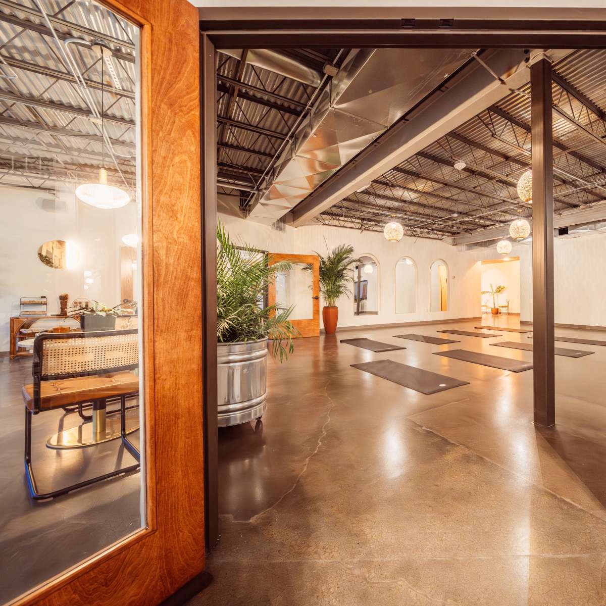 Large artist loft space filled with tropical plants, open ceilings ...