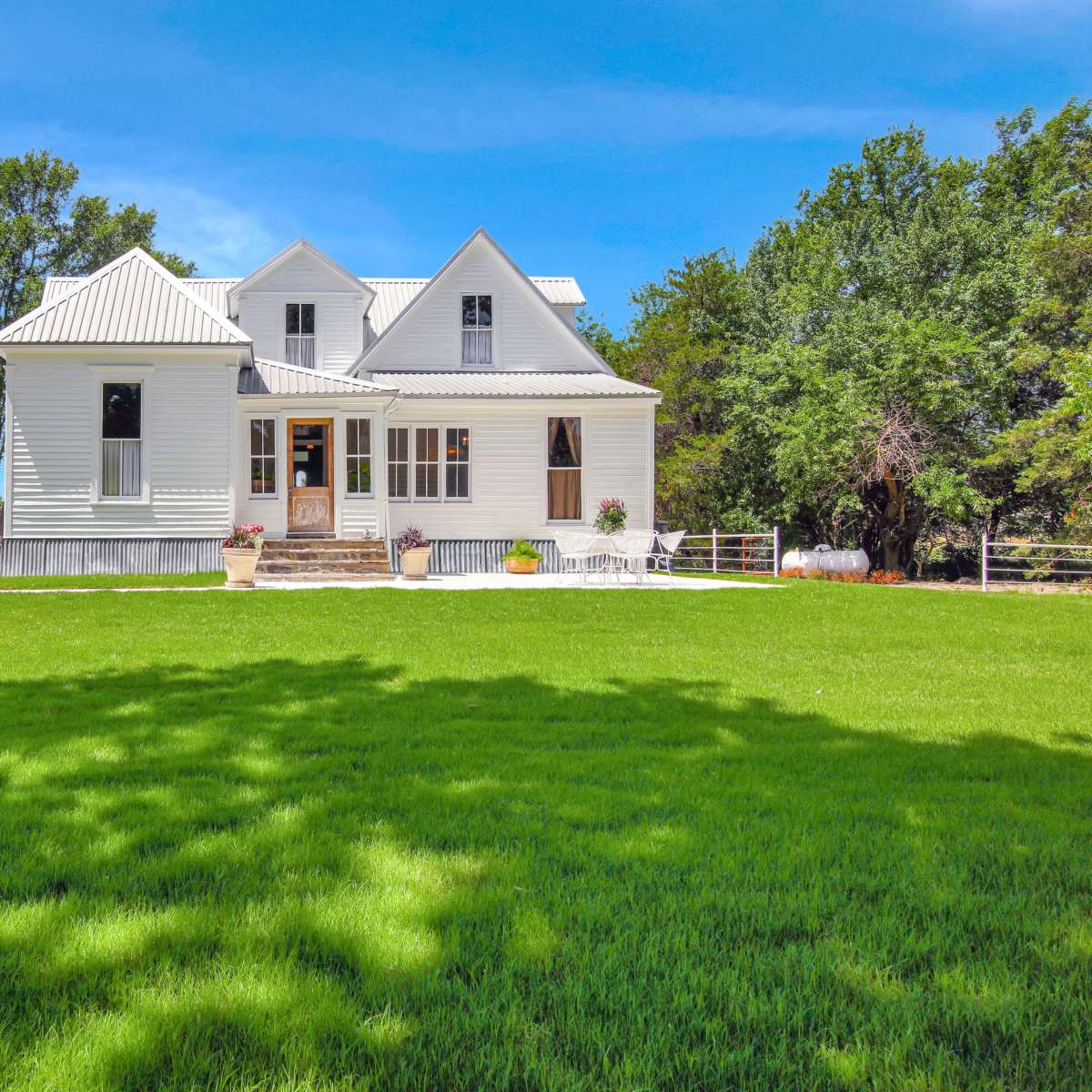 Charming 1905 farmhouse surrounded by large mature trees on secluded ...