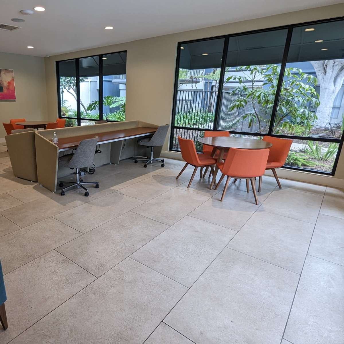 Bright Wi-Fi Lounge w/ View, Table & Chair Seating and Cubicle Break ...