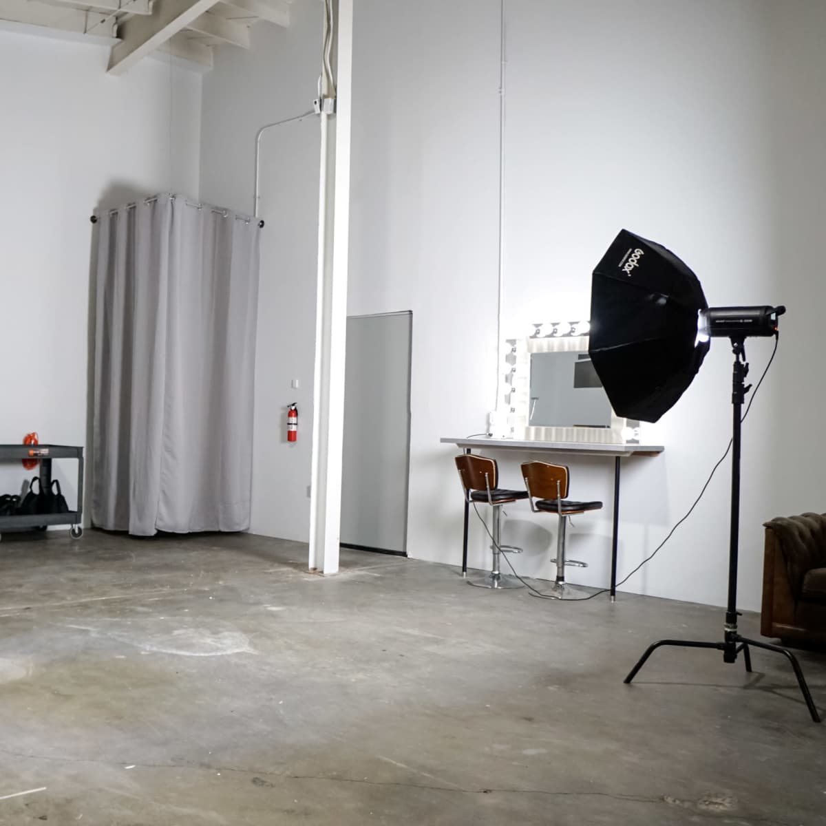 Large photo studio with white walls, leather couch and included ...