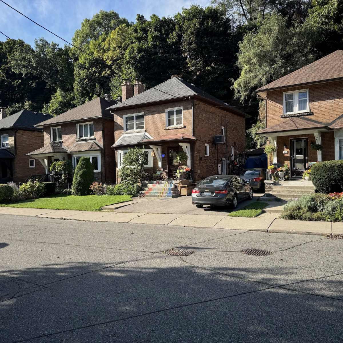 Eclectic and Colorful Art-Filled Red Brick Home with Scenic Hill Garden ...