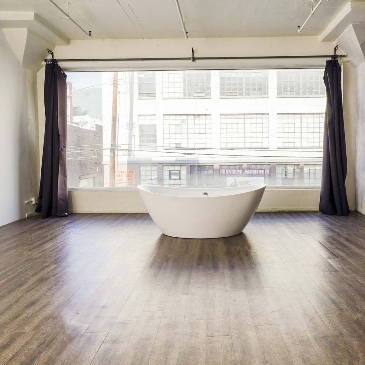 Large Downtown Studio with Frameless Windows, City Views, round window ...
