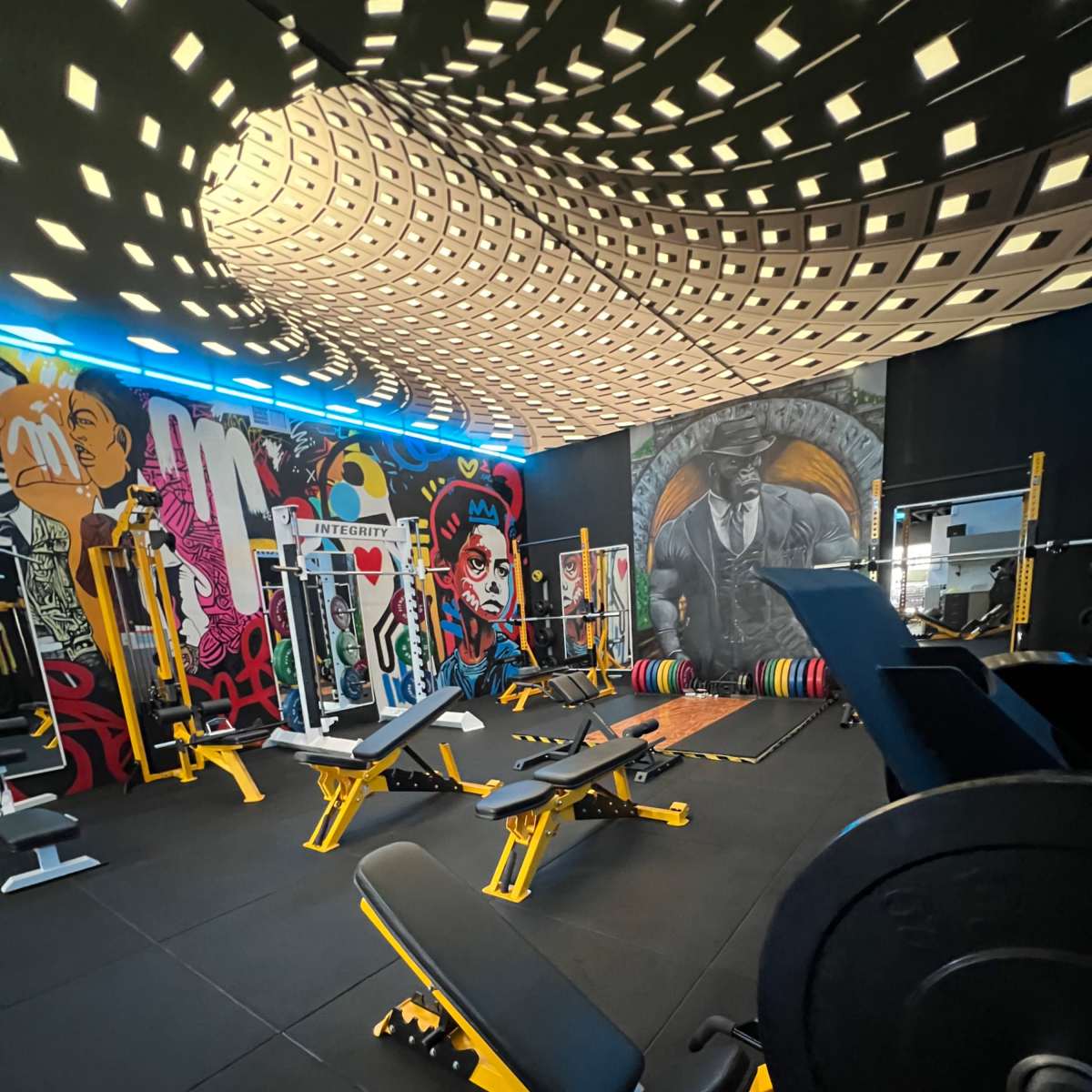 Vibrant gym studio filled with abundant equipment, pulsating music ...