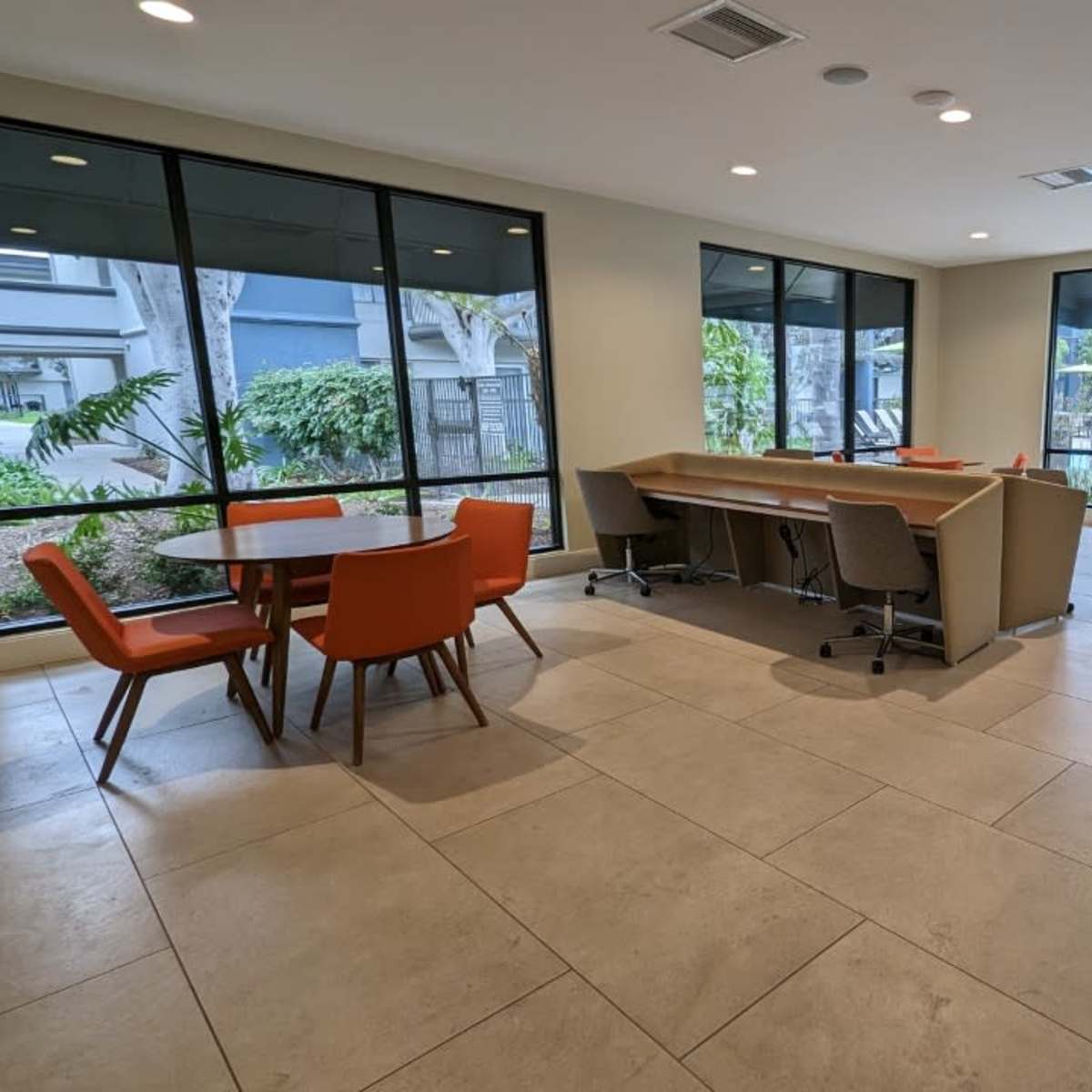 Bright Wi-Fi Lounge w/ View, Table & Chair Seating and Cubicle Break ...