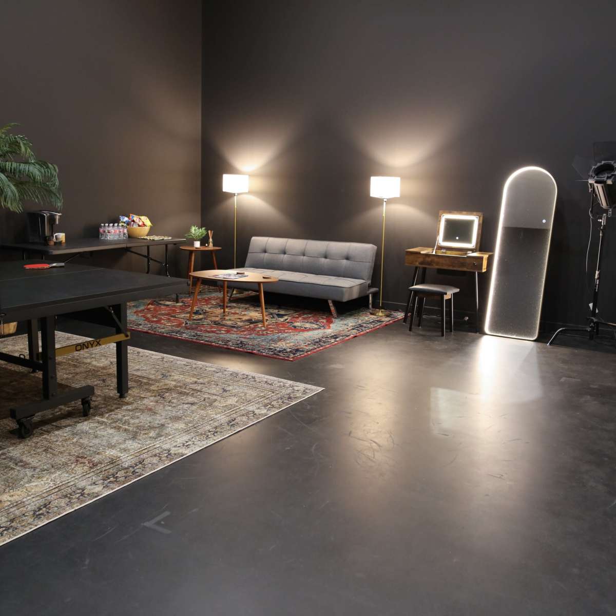 Big beautiful wide open video/photo studio. Half black walls half white ...
