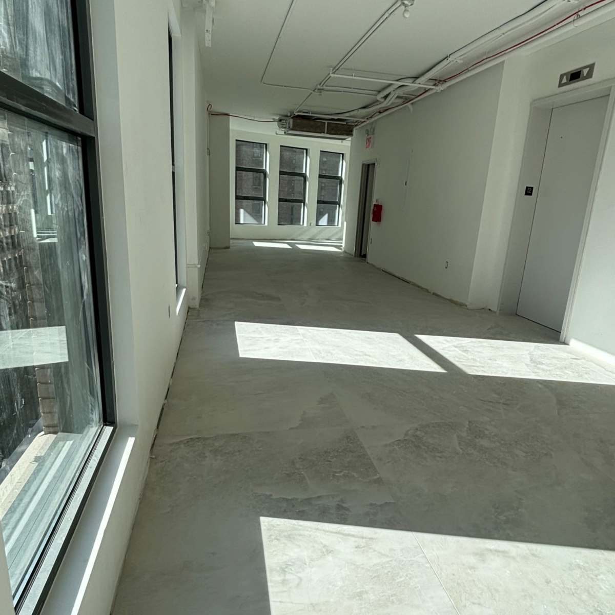 Concrete office space in Nomad; high level w/ multiple windows, New ...