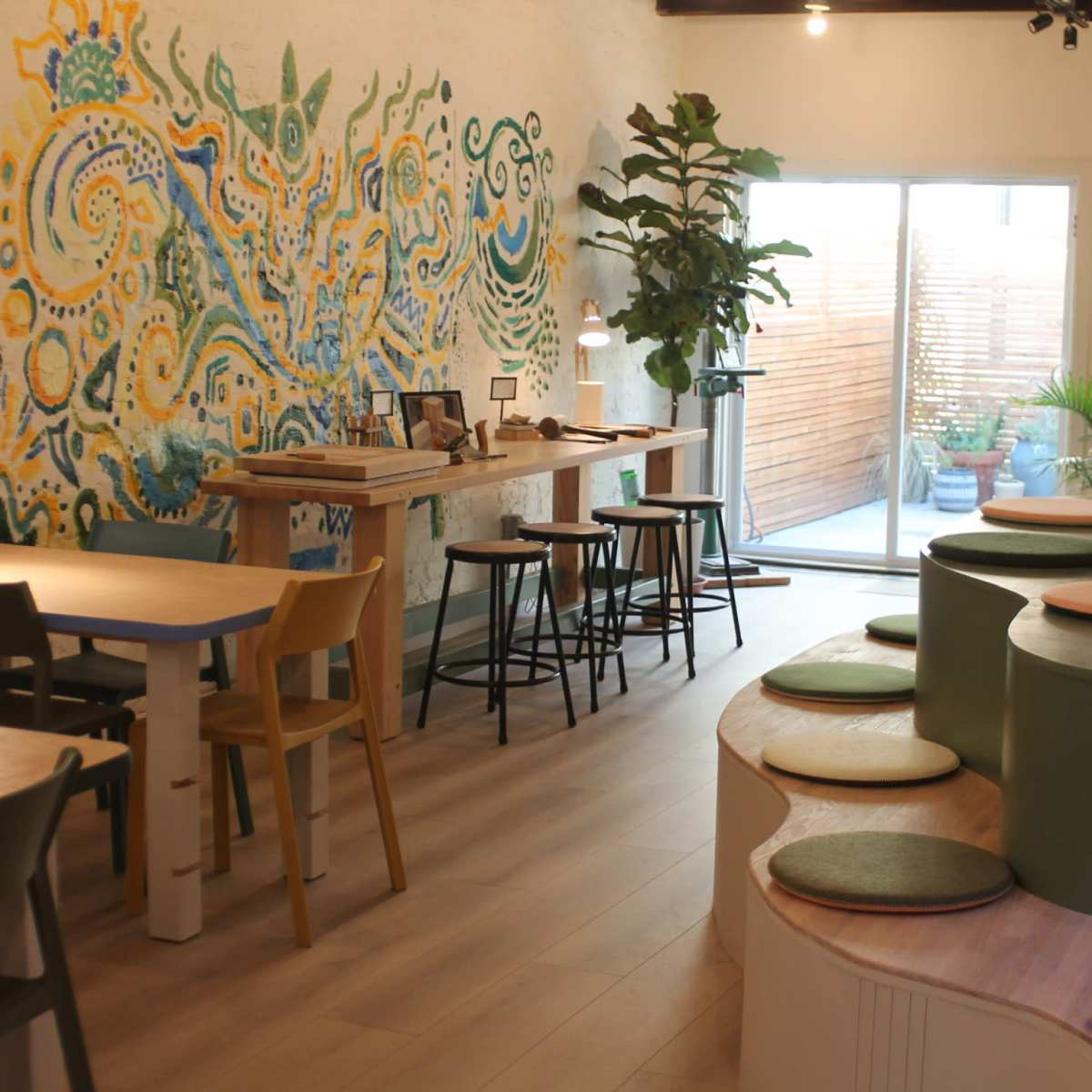 sky lit multi-use space with hand-crafted decor and plants galore ...