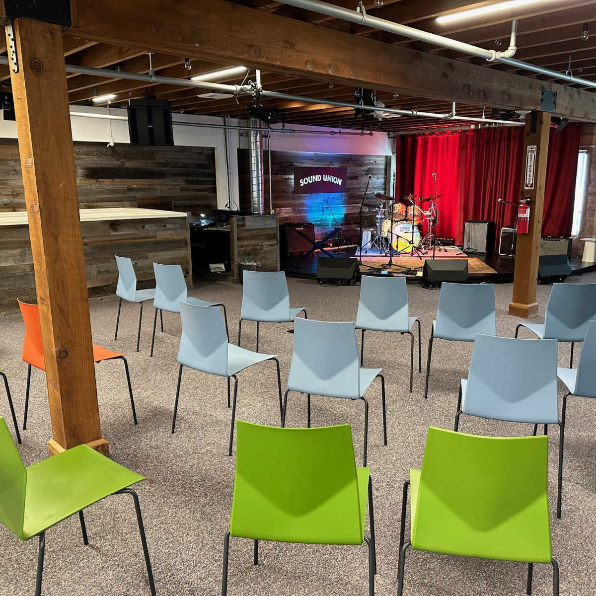 Large open loft, music and podcast studios, and performance stage with ...