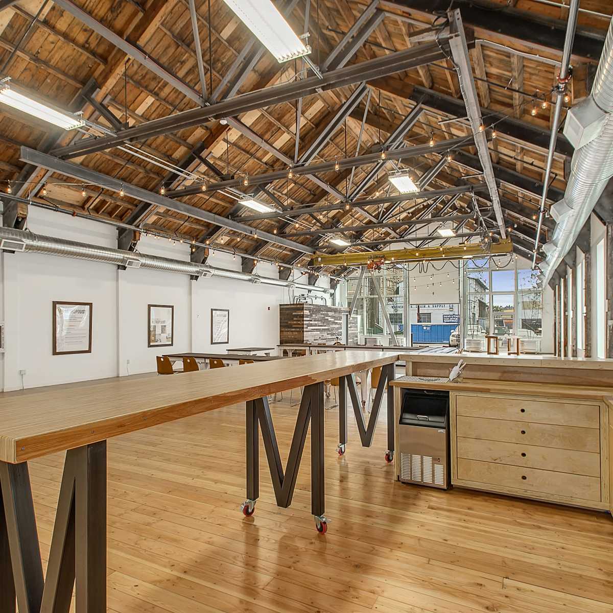 Industrial hall with reclaimed wood, high ceilings and steal beams ...