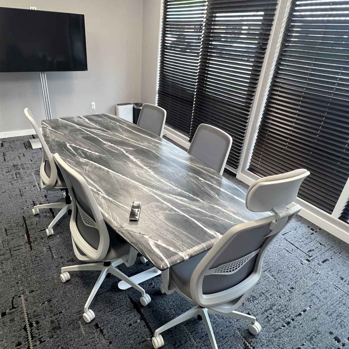 Modern Hybrid-Capable Conference Room with Sit-Stand Meeting Table ...