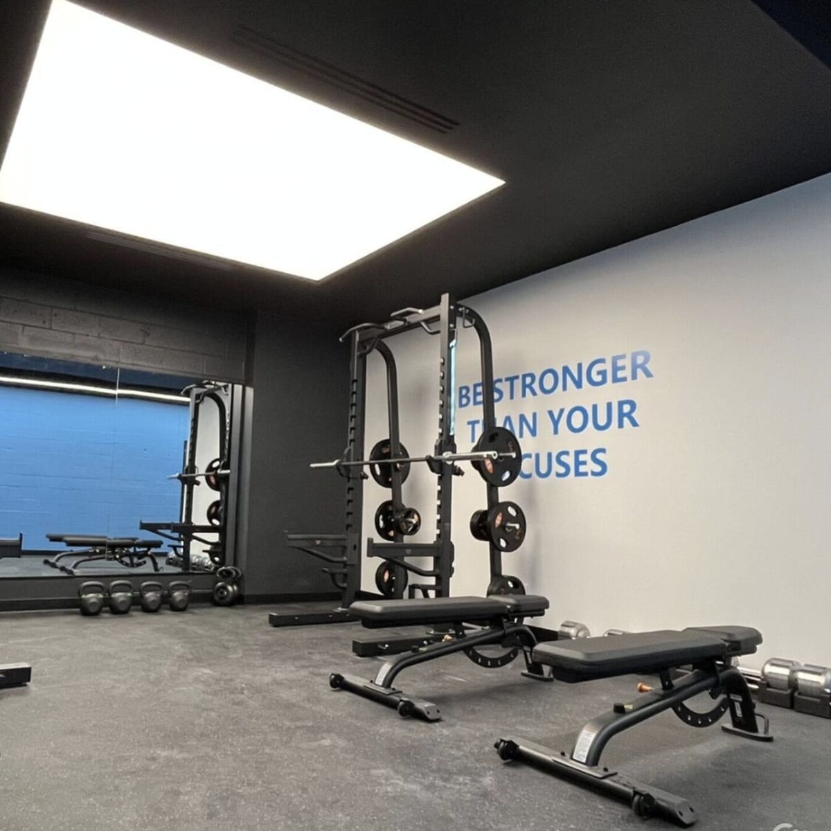 Sleek Fitness Studio With Modern Custom Lighting and Top-Notch ...