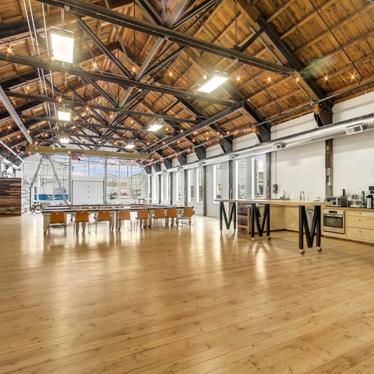 Industrial hall with reclaimed wood, high ceilings and steal beams ...