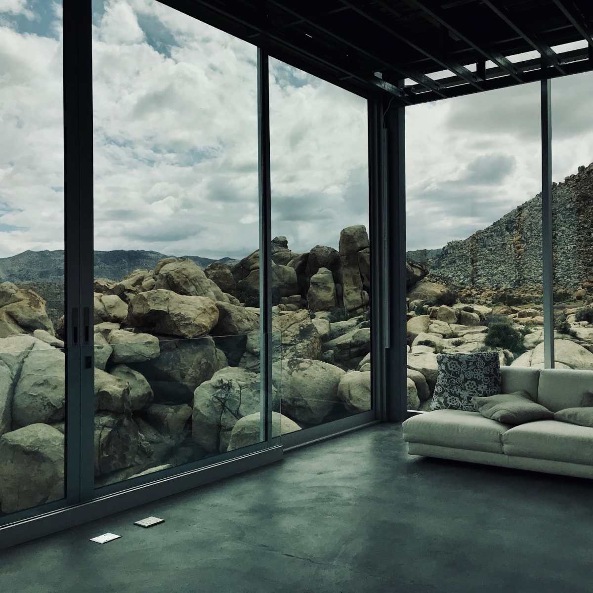 Invisible House mirrored nestled in 90 acres of rocks like another ...