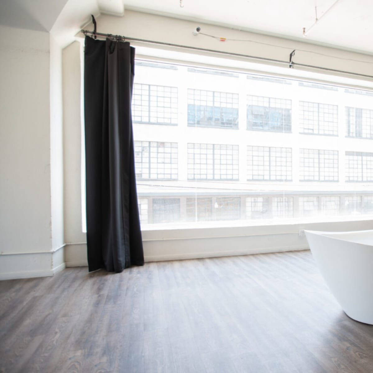 Large Downtown Studio with Frameless Windows, City Views, round window ...