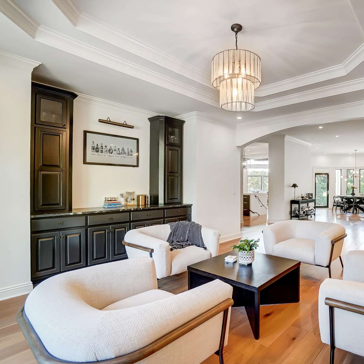 Picturesque tree lined home on a pond with a swimming pool, open ...