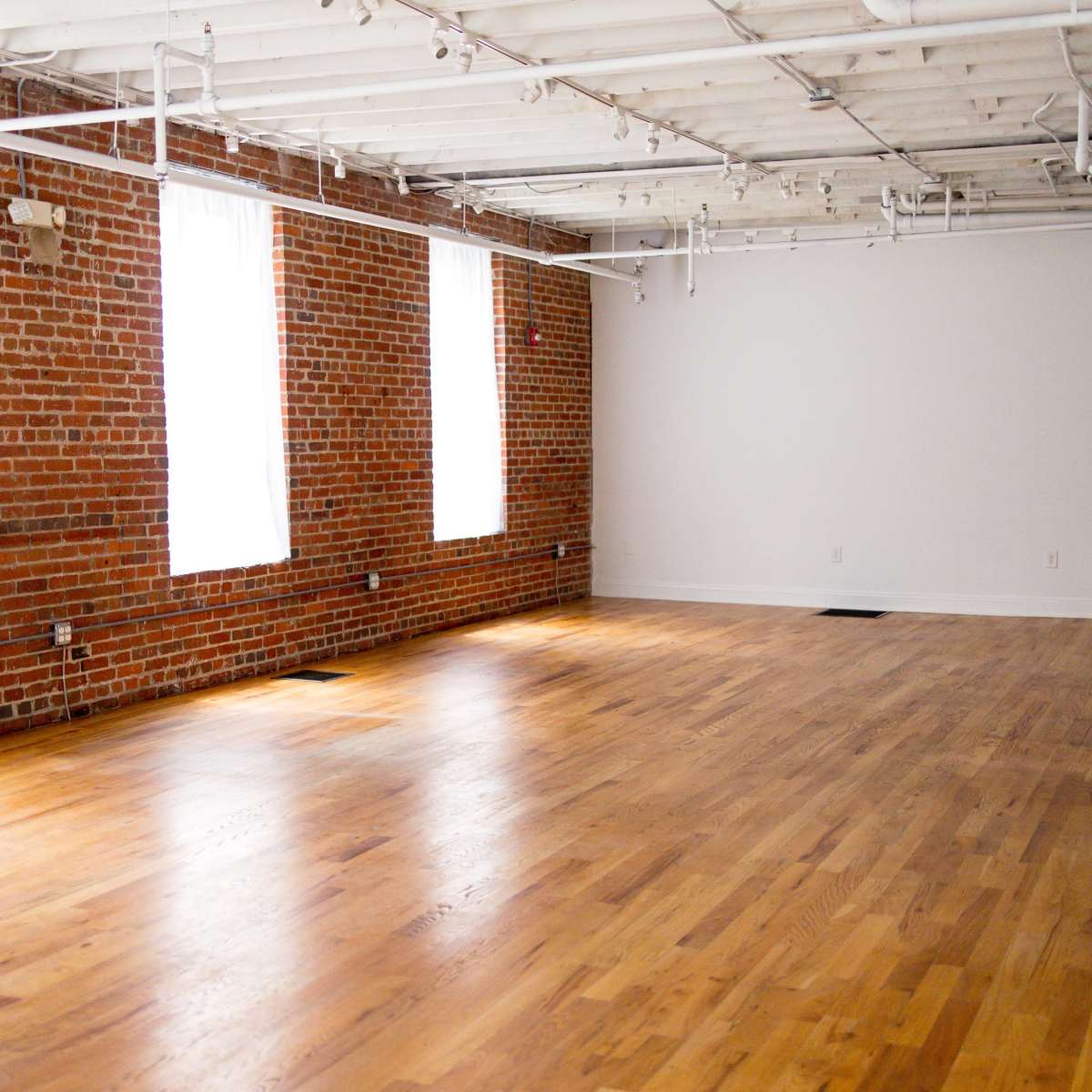 Modern Downtown Studio Loft with Exposed Brick and Hardwood Floors ...