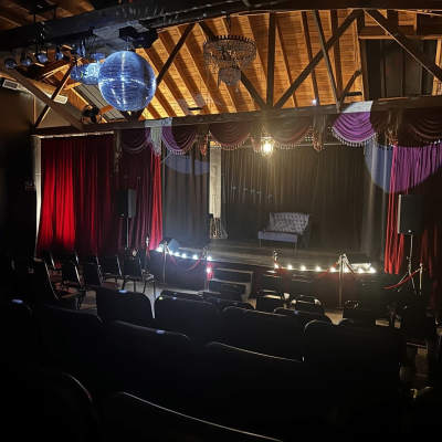 Gorgeous Bohemian theater with Red Velvet Curtains and Wood Beam ...