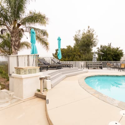 Spacious resort style backyard with pool, fireplace and barbeques ...