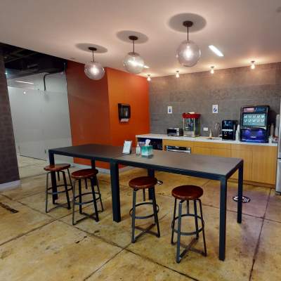 Open Cool Lounge Area in an office setting with open ceilings, natural ...