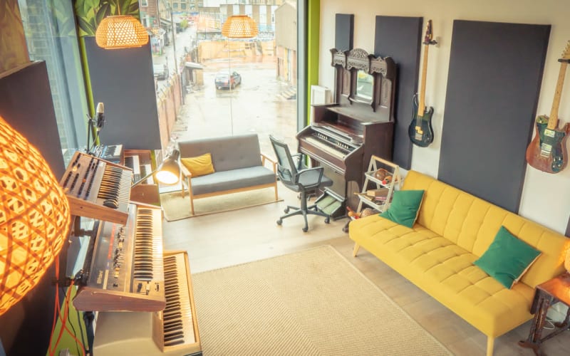 Recording studio with natural light and views of local urban area ...