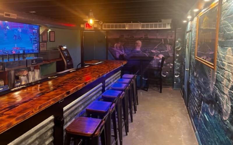 Rustic exposed brick bar with beautiful wall murals located in Adams ...