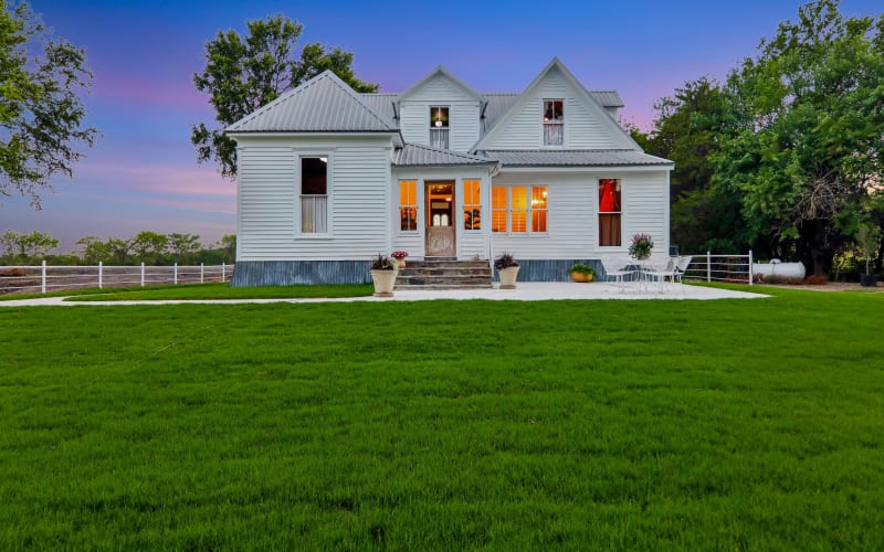 Charming 1905 farmhouse surrounded by large mature trees on secluded ...