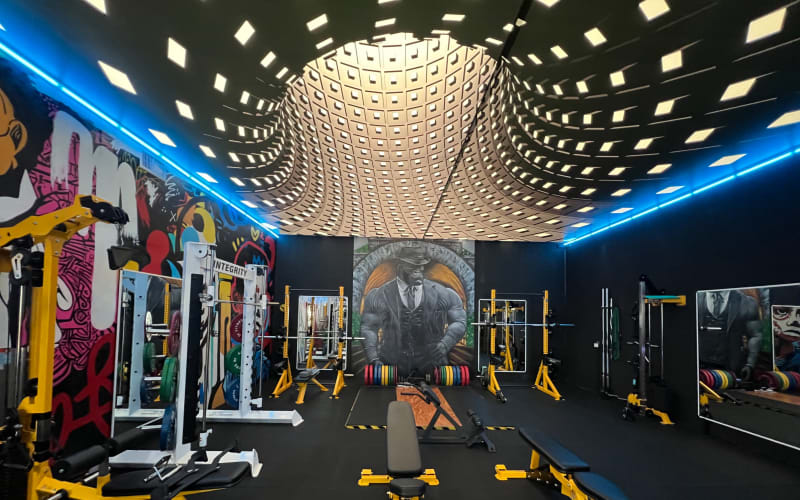 Vibrant gym studio filled with abundant equipment, pulsating music ...