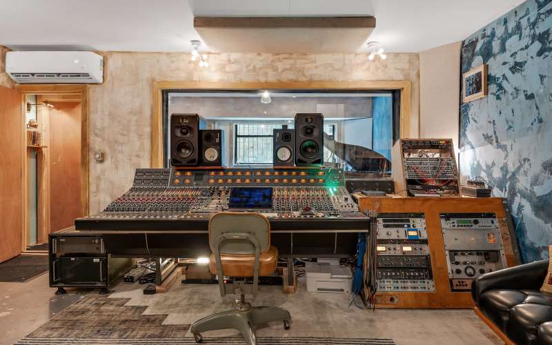 Spacious elegant recording studio with natural light and a refined ...
