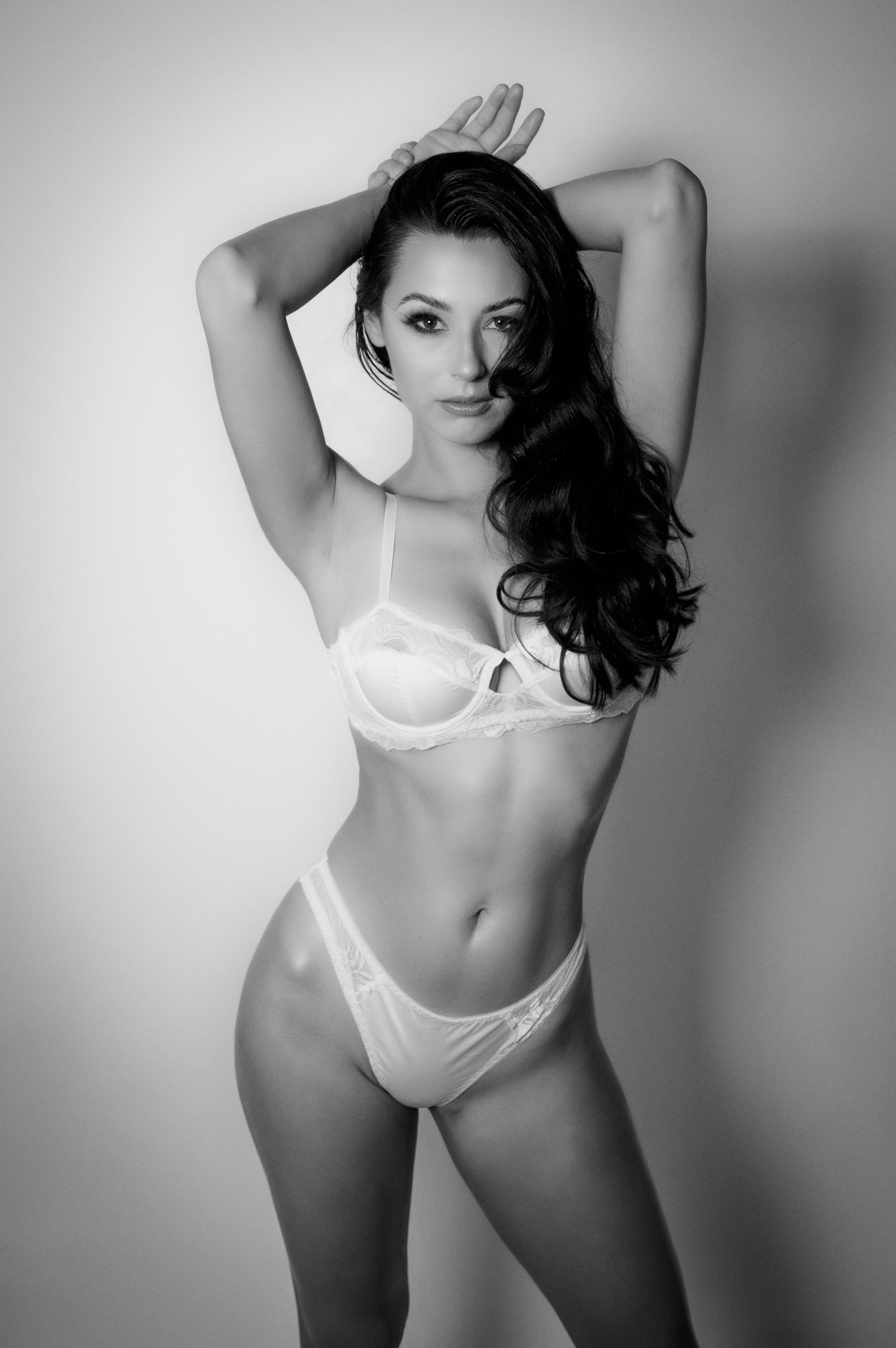 A Black And White Boudoir Photoshoot Of A Woman In Lingerie By Ashley