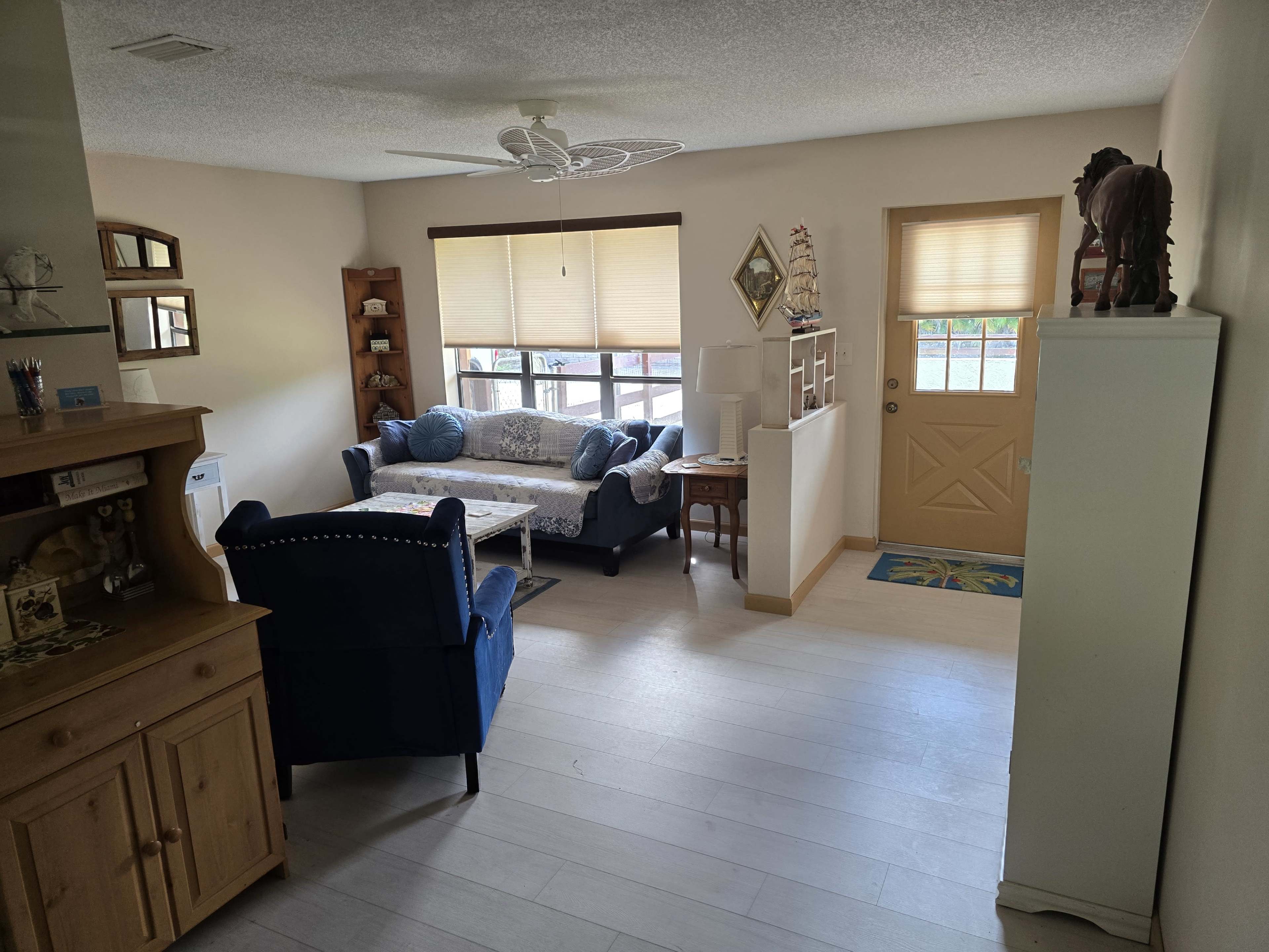 Country setting with tropical accents (tiki huts, pool area and pond ...