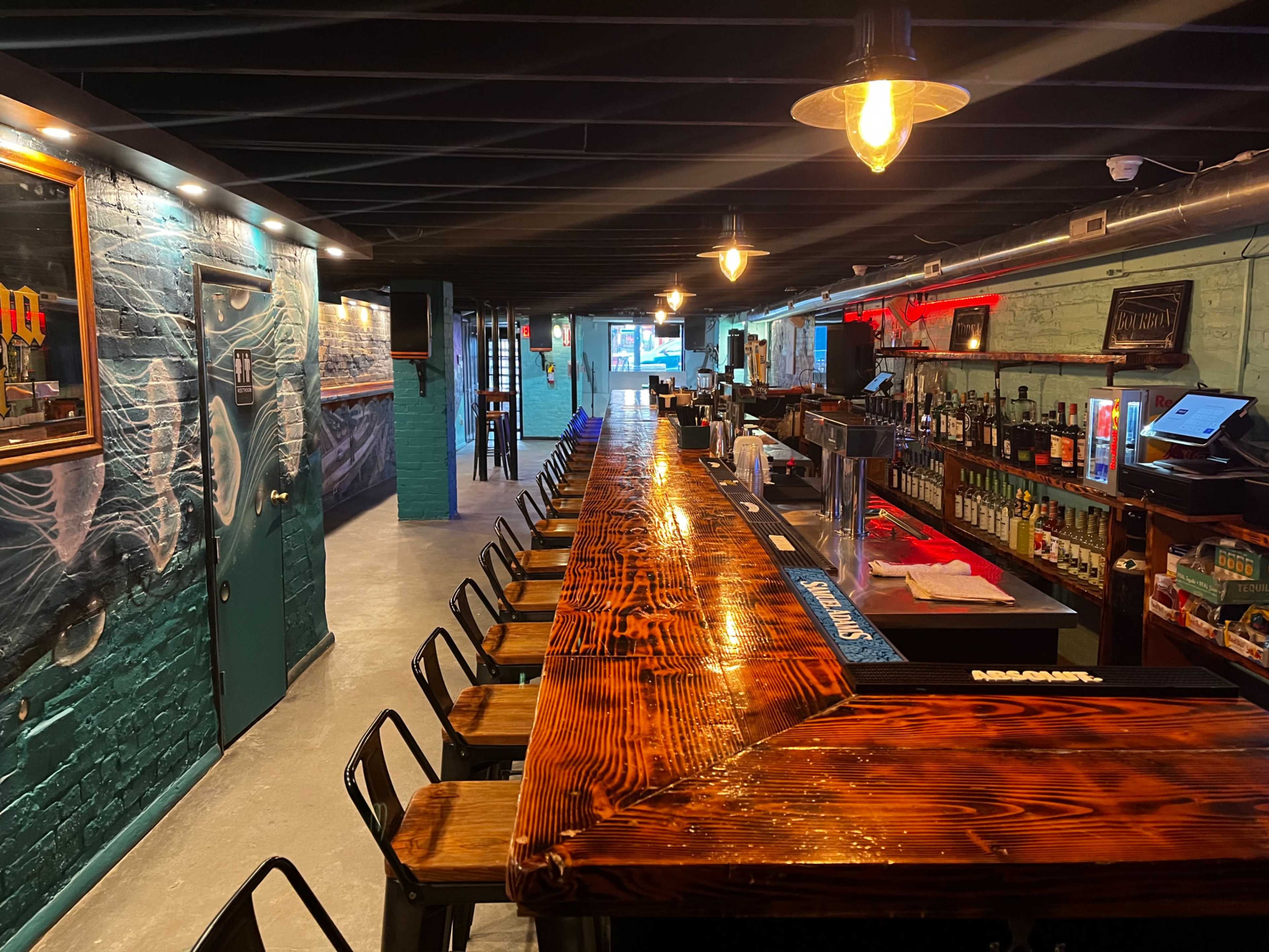 Rustic exposed brick bar with beautiful wall murals located in Adams ...