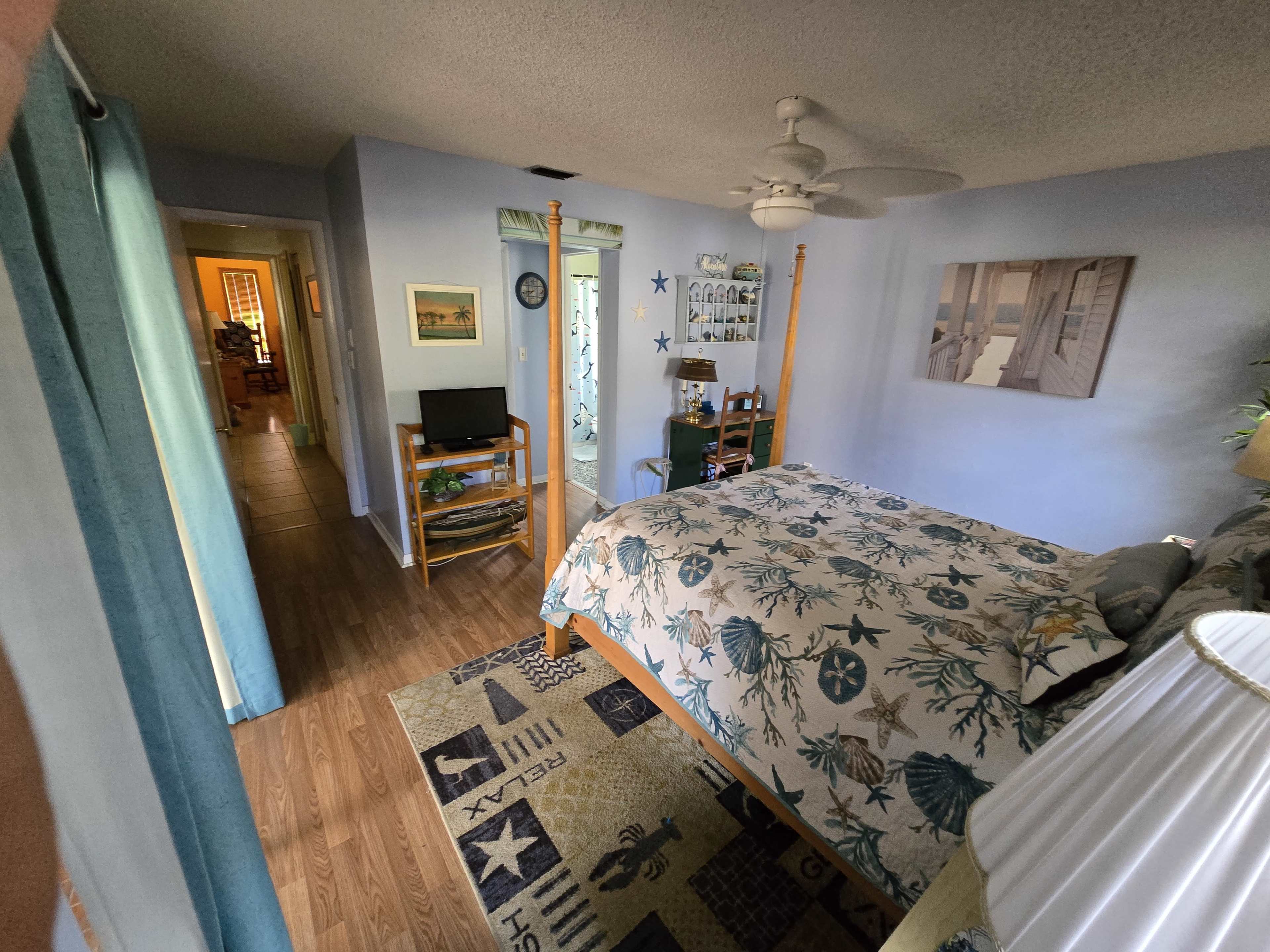 Country setting with tropical accents (tiki huts, pool area and pond ...