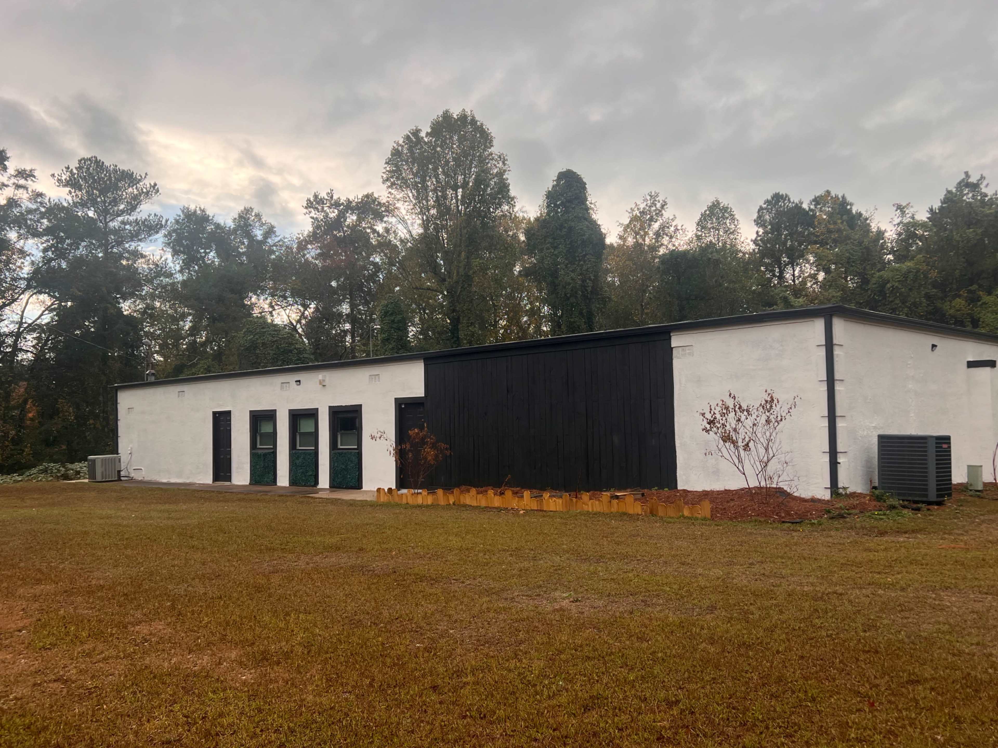 Suburban Area with stand alone building on top of the hill near fire ...