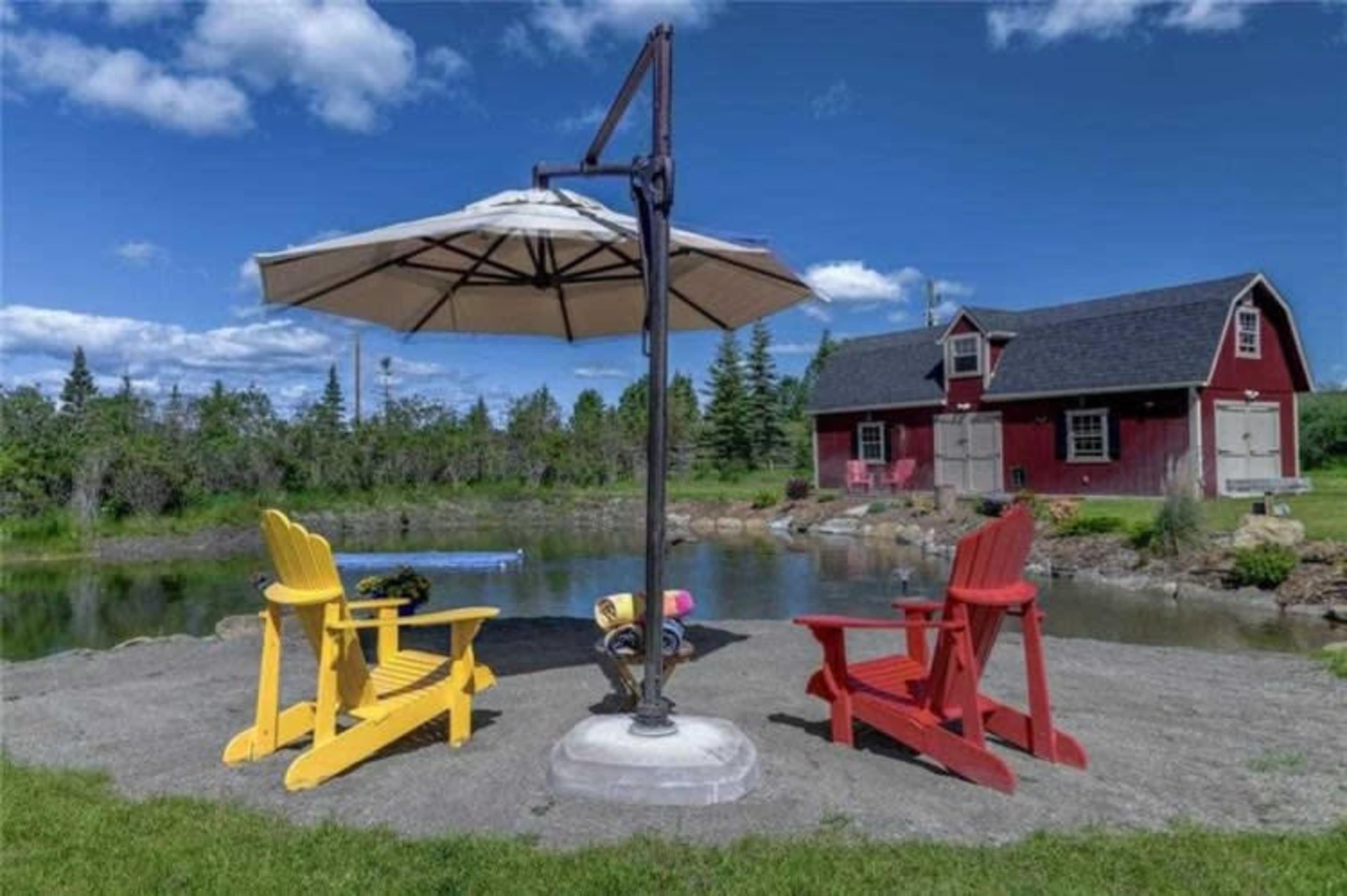 Country Paradise on 15 acres with a creek, forest, barn & pond, Priddis ...