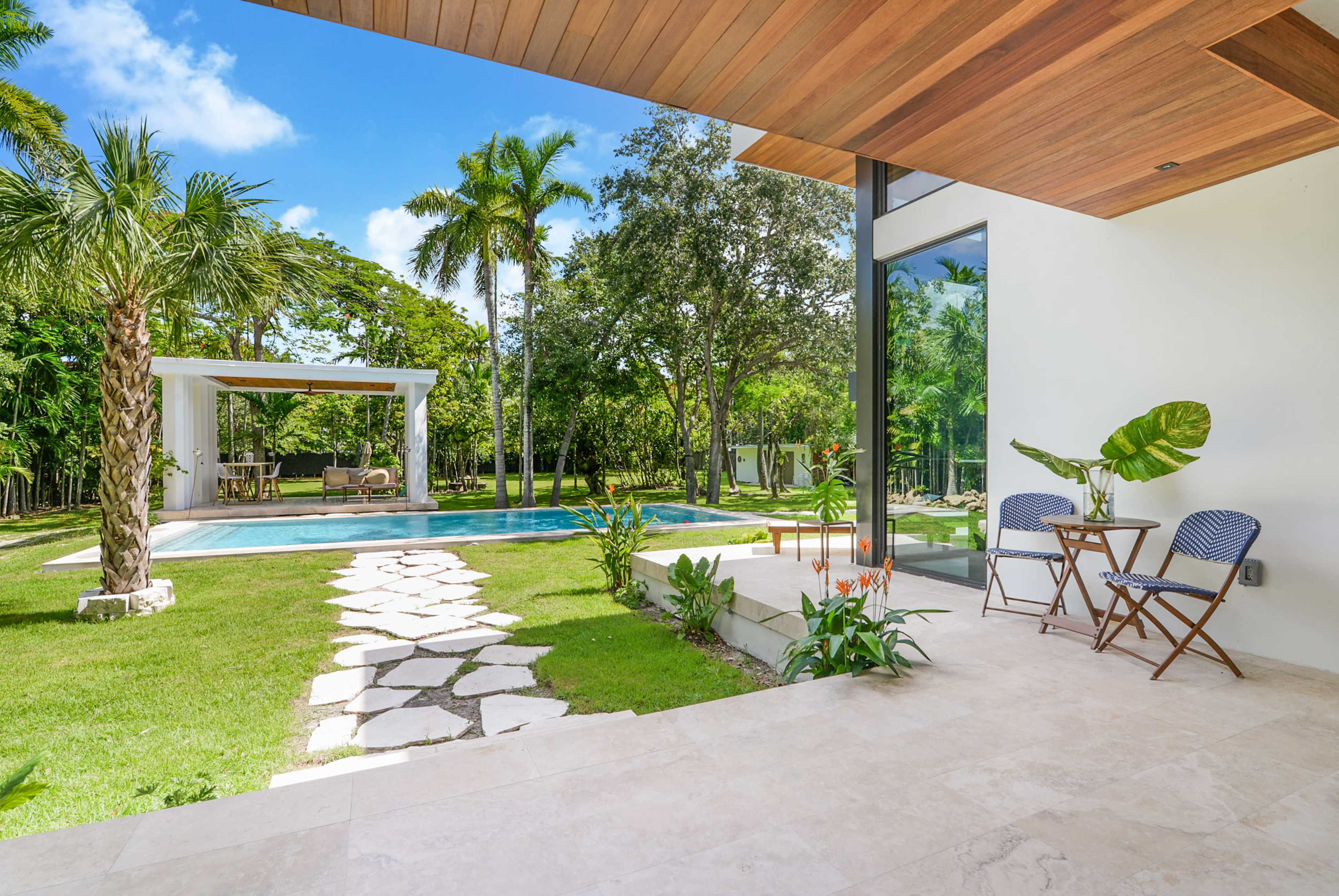 Modern Tropical Estate with Lush Tropical Landscape, Pool, and Cabana ...